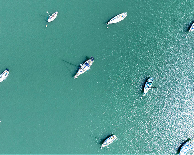 Boats scattered across turquoise waters like toys in a bathtub&mdash;except this bathtub comes with fresh seafood and spectacular sunsets.