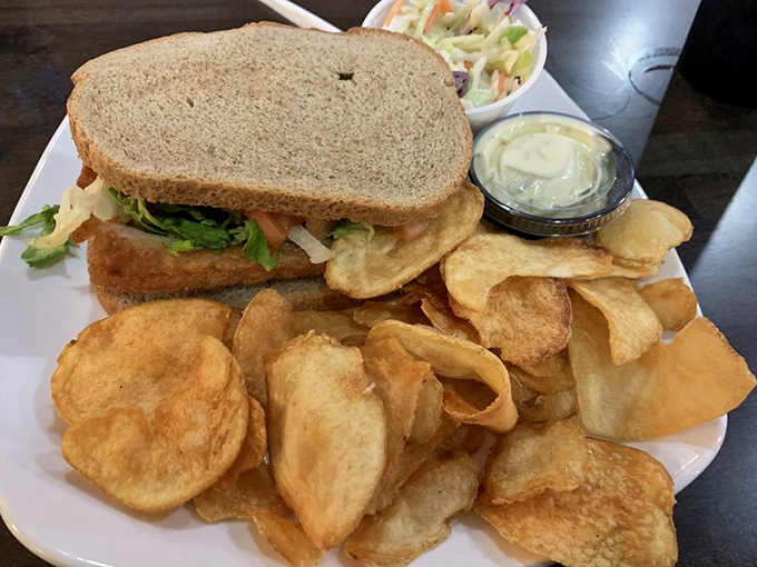 A sandwich that requires strategic planning before each bite &ndash; architecture of deliciousness with house-made chips as the foundation.