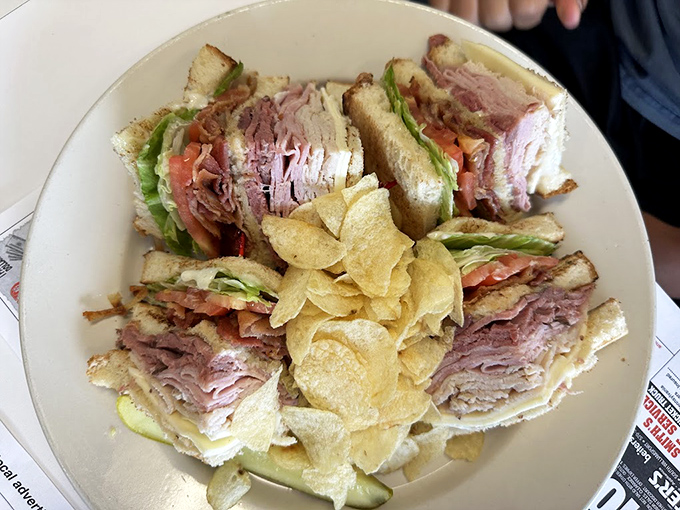 The club sandwich: Architecture you can eat. Three stories of deli perfection with enough layers to require engineering skills to consume.