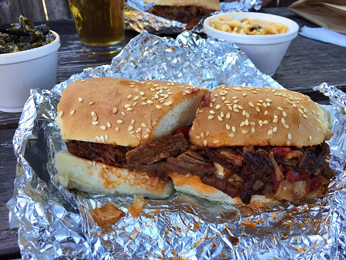 The sandwich that launched a thousand napkins. Sesame-speckled bun barely containing a mountain of meat that's been smoking longer than some college students.