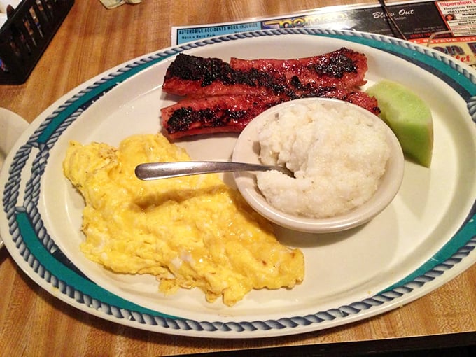 Perfectly scrambled eggs alongside crispy bacon and grits &ndash; the breakfast trinity that's converted more northerners to southern ways than anything else in history.