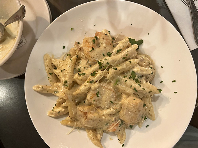 Pasta that doesn't just carry seafood—it celebrates it. Each twirl of fettuccine delivers a creamy promise of oceanic delight.