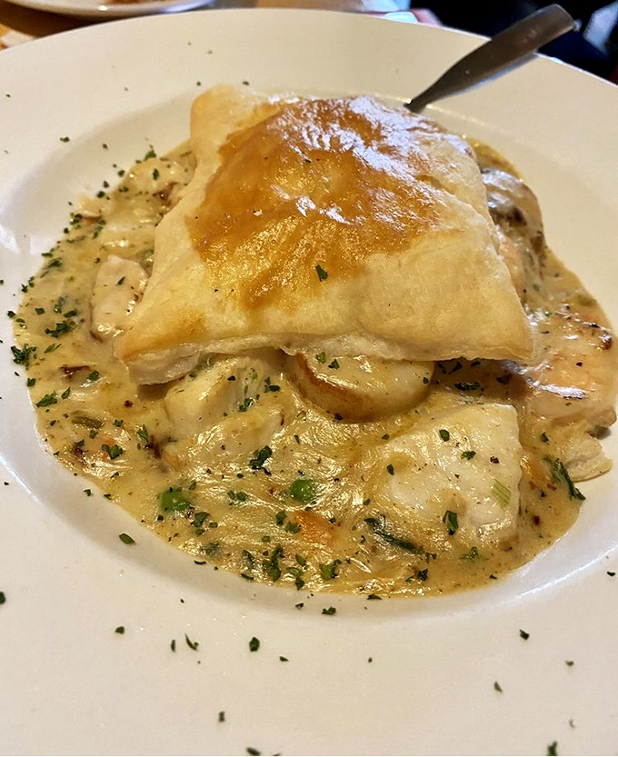 Not your grandmother's pot pie (though she'd approve). This seafood masterpiece under golden pastry is Florida comfort food elevated to art.