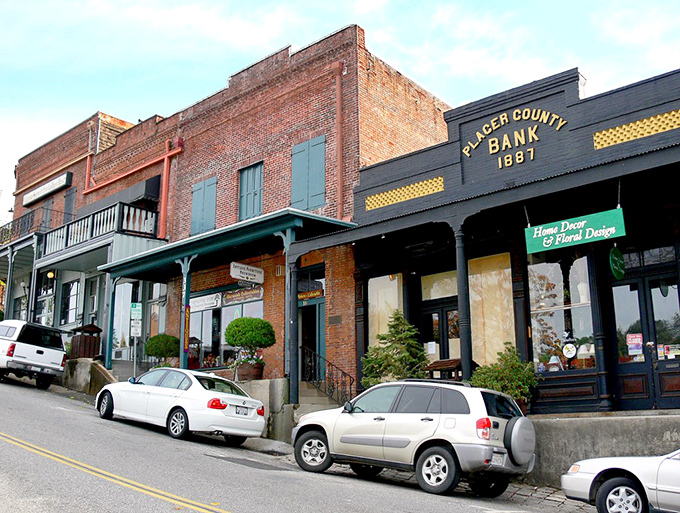 The Placer County Bank building anchors a street where every storefront tells a story&mdash;brick, balconies, and not a chain store in sight.