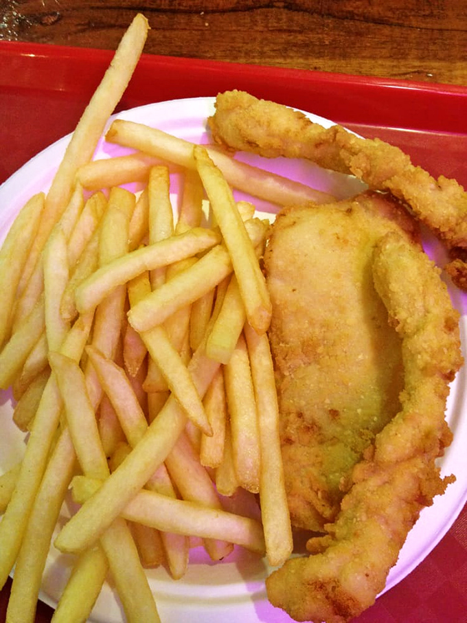 Golden-battered fish and perfectly crisp fries—the kind that make you wonder why anyone bothers with those fancy restaurants where portions fit on a spoon.