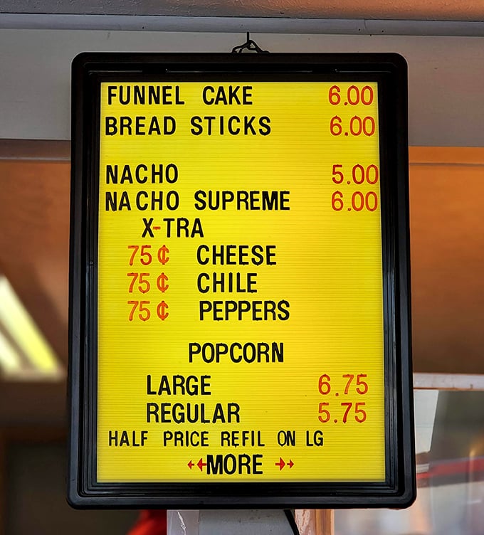 The menu board &ndash; a nostalgic yellow beacon offering funnel cakes and nachos supreme. Cinema cuisine that hasn't changed because it doesn't need to.