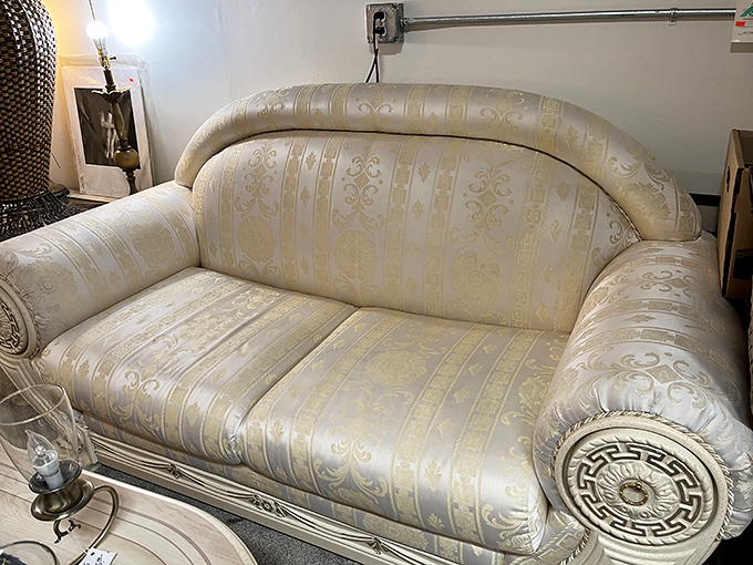 The throne room! This cream brocade sofa isn't just seating&mdash;it's a statement piece that screams "I've hosted fancy people!"