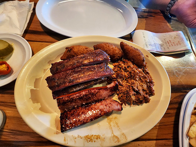 Those perfectly charred ribs and pulled pork represent hours of patient smoking transformed into minutes of pure bliss.