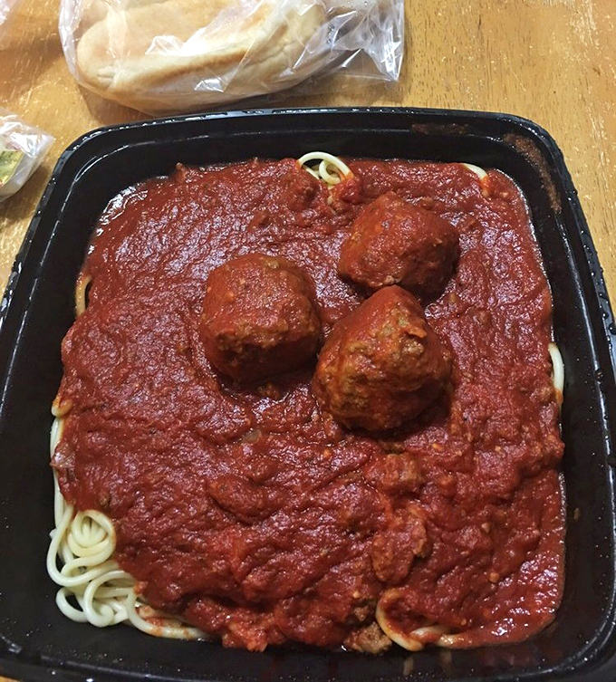 Spaghetti and meatballs arrive like old friends, swimming in sauce that whispers "welcome home."