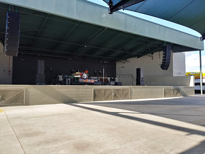 This unassuming stage transforms into a vibrant performance space where local bands create the soundtrack for your shopping adventure.