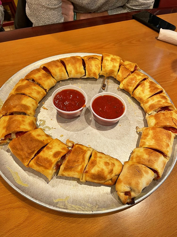 Golden stromboli slices arranged like edible sunshine, each bite bursting with melted cheese perfection.