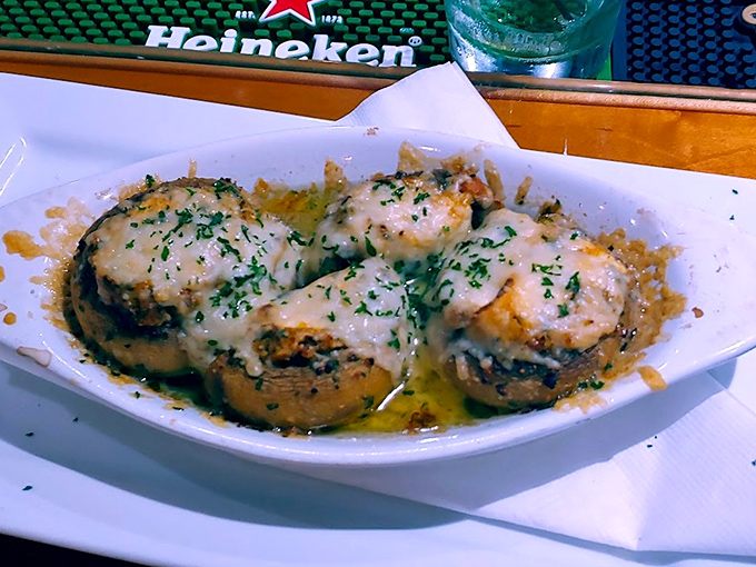 These aren't just stuffed mushrooms; they're little boats of joy sailing on a sea of melted cheese and garlic butter.