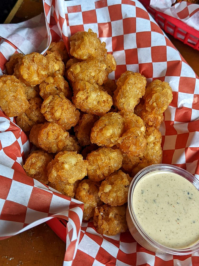 These golden nuggets of fried potato goodness aren't just tater tots &ndash; they're little ambassadors of happiness with a dipping sauce diplomatic passport.