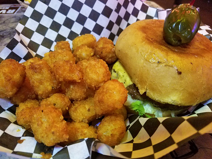 Tater tots: the unsung heroes of bar food. Paired with this burger, they're like the perfect backup singers to a rock star.