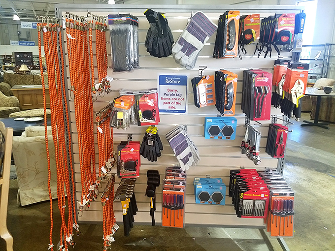 Work gloves and measuring tapes await their next adventure. This tool section is where weekend warriors arm themselves for battle against unfinished projects.