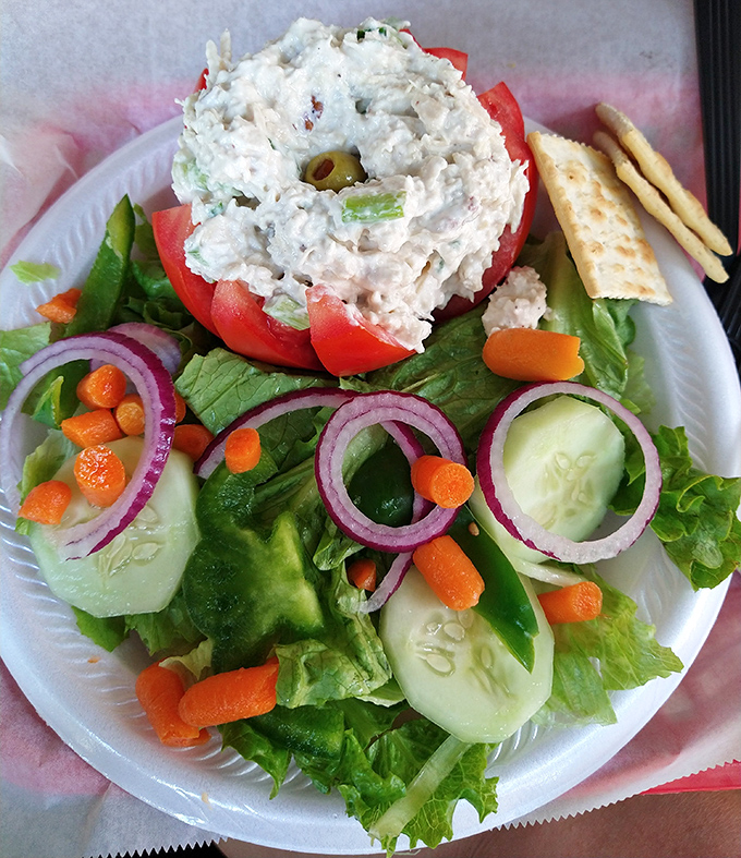 Garden-fresh vegetables cradle a generous scoop of tuna salad&mdash;proof that sometimes the simplest combinations make the most profound statements.