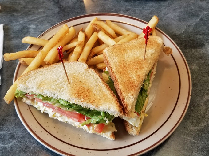 The club sandwich: architecture you can eat. Perfectly toasted bread holding the delicate balance between healthy (lettuce) and happiness (everything else).