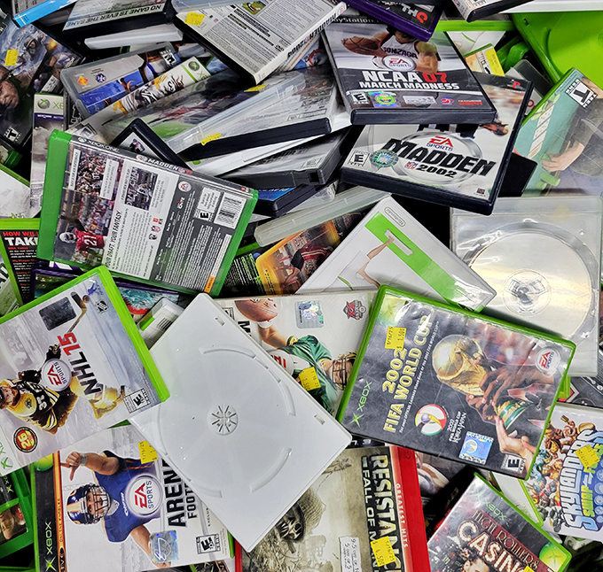 Video game graveyard or nostalgic gold mine? Madden NFL titles and forgotten classics create a time capsule of rainy Saturday afternoons.