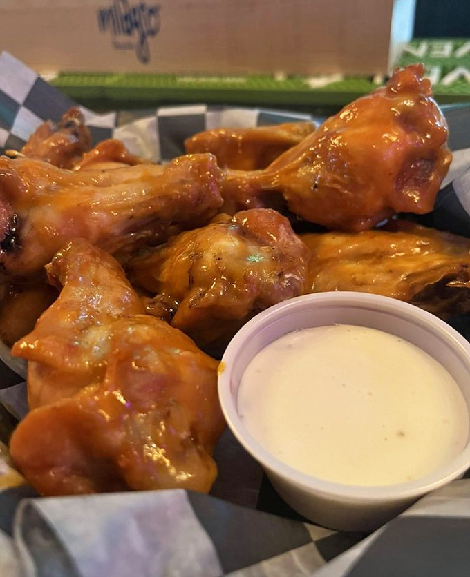 These wings aren't just good, they're "text-your-friends-immediately-and-cancel-all-plans" good. The sauce glistens with promises it fully intends to keep.