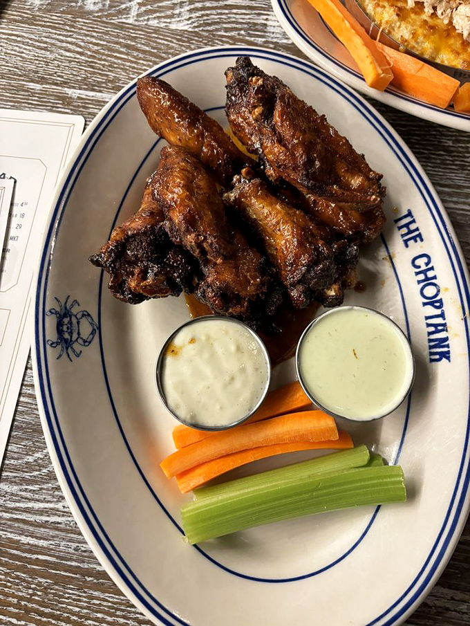 Wings that would make Buffalo jealous! Crispy, saucy perfection served with cooling dips and the kind of vegetables that let you pretend this is health food.