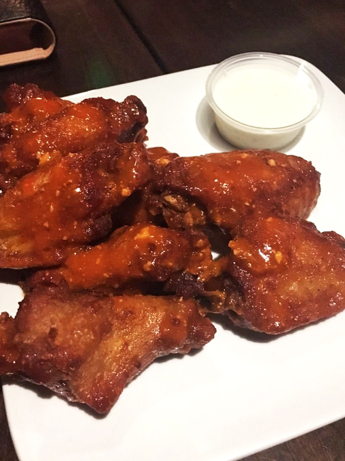 These wings aren't just wings&mdash;they're flavor delivery vehicles, glistening with sauce and demanding your full attention. 