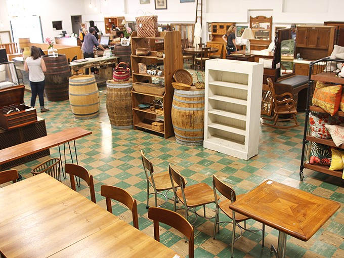 Wooden barrels and vintage tables create RERUN's signature aesthetic&mdash;part rustic farmhouse, part urban loft, all with more character than the entire IKEA catalog.