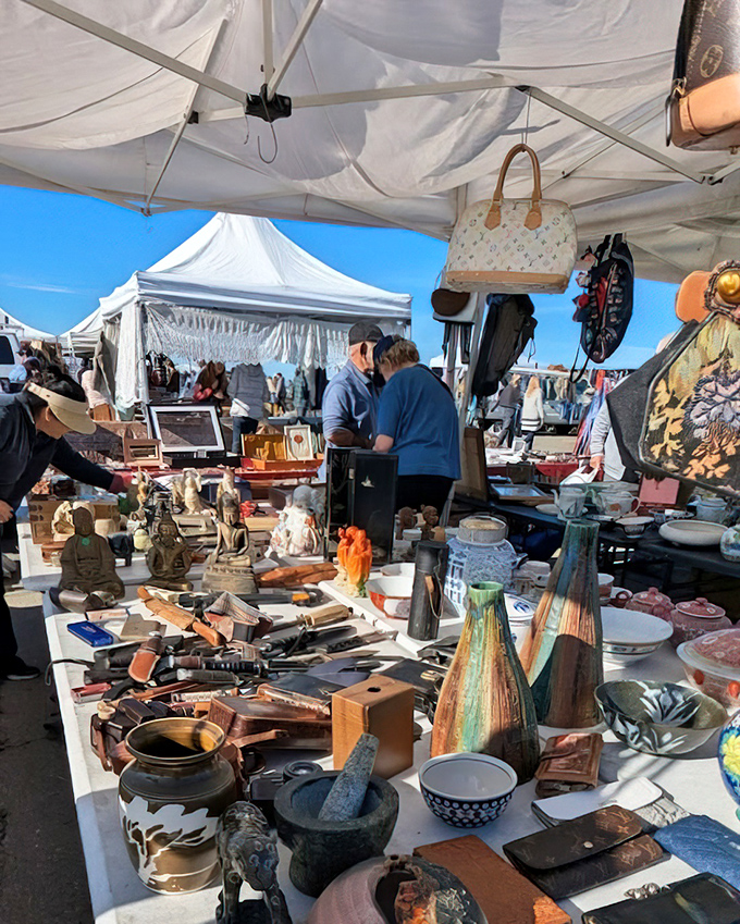 Artisan pottery, wooden mortars, and decorative vases create a museum-like display of handcrafted treasures at Alameda's Antiques Faire.