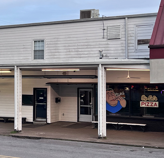 Big Ed's unassuming white exterior gives no hints about the legendary pizza experience waiting inside.