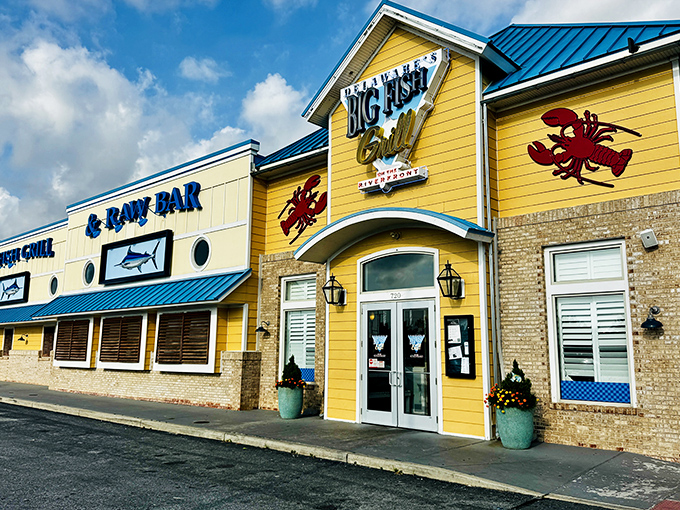 Big Fish Grill's sunny yellow exterior and bold blue trim hint at the colorful seafood experience waiting inside this Wilmington favorite.