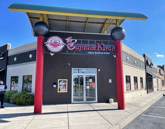 Captain Krab (storefront): "Those bold red pillars aren't just for show&mdash;they're signaling that Cajun seafood excitement awaits inside!"