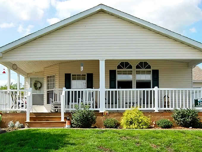 Front porch living at its finest, where morning coffee tastes better when your housing costs stay reasonable.