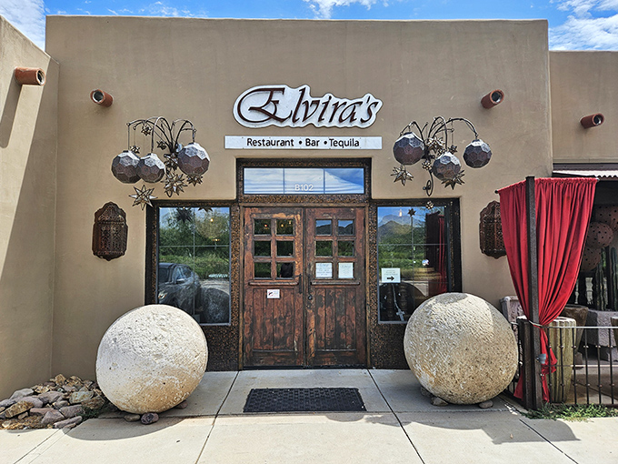 Elvira's dramatic entrance says, "This isn't just dinner, it's an experience." Those massive stone spheres are like bouncers for your taste buds.