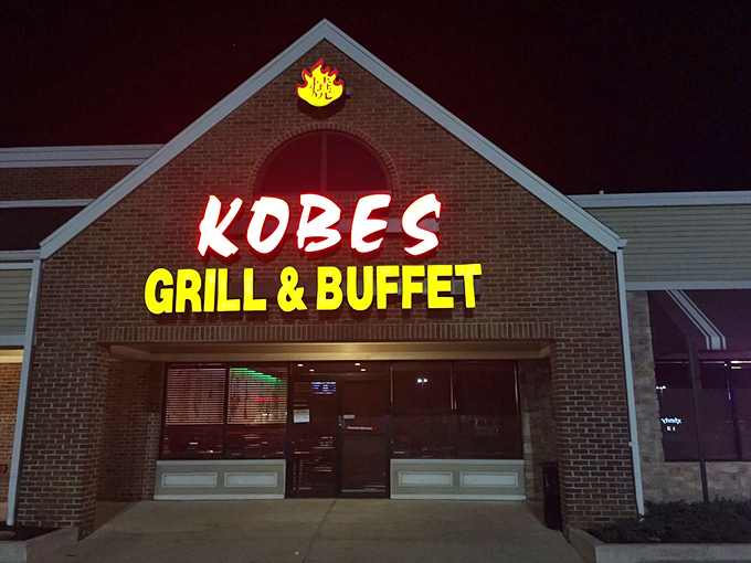 Kobe's glowing sign cuts through the night like a neon promise of hibachi delights waiting just beyond those doors.