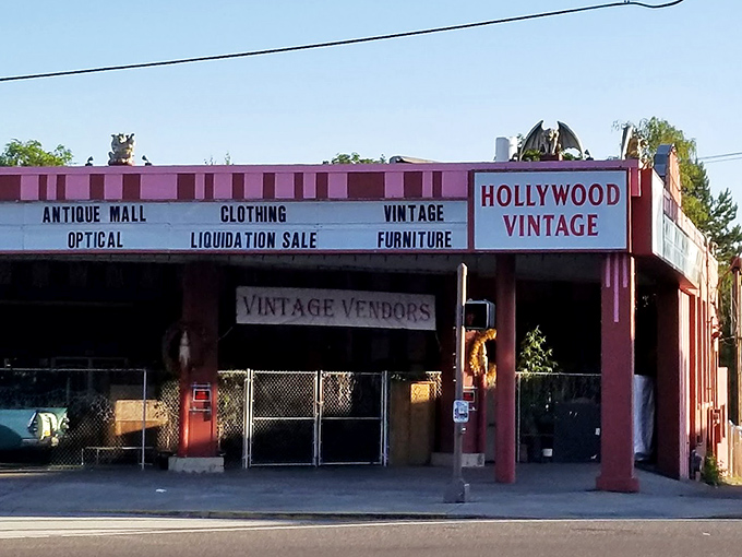Hollywood Vintage's distinctive pink building stands out like a flamingo in Portland, promising theatrical treasures within.