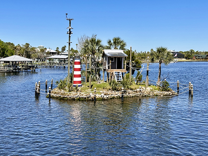 Homosassa Springs' lighthouse island stands like a cheerful sentinel, guarding the entrance to Old Florida's natural treasures.