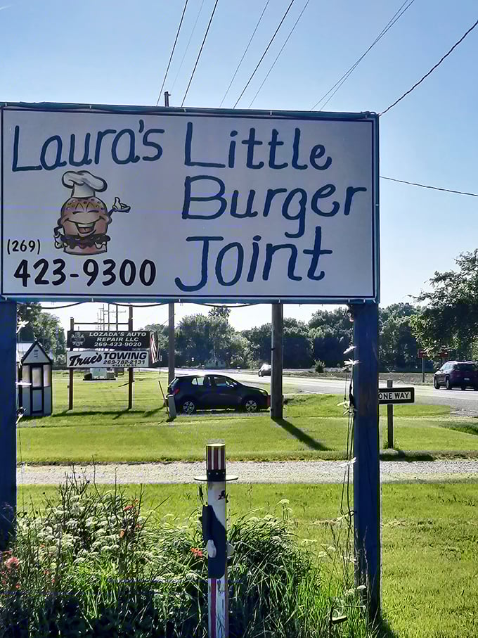 Laura's cheerful sign with that grinning burger mascot &ndash; when your food is this good, it practically smiles back at you.