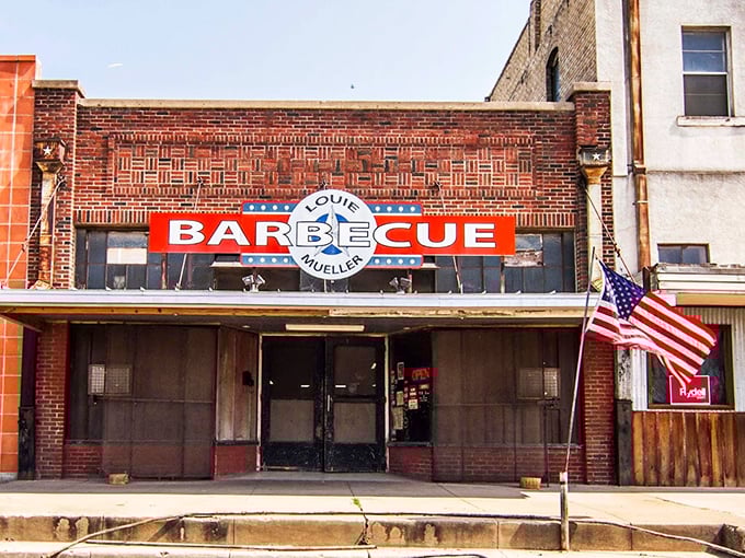 Louie Mueller Barbecue (Taylor): The brick facade tells stories of decades of smoke. An American flag salutes this temple of Texas tradition.