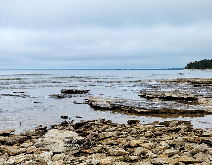 Manistique's shoreline whispers tales of Great Lakes shipping. The perfect spot to watch for freighters on the horizon.