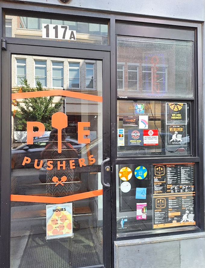 That bold orange "PIE PUSHERS" logo isn't just a name&mdash;it's a mission statement. These folks are determined to elevate your pizza experience.