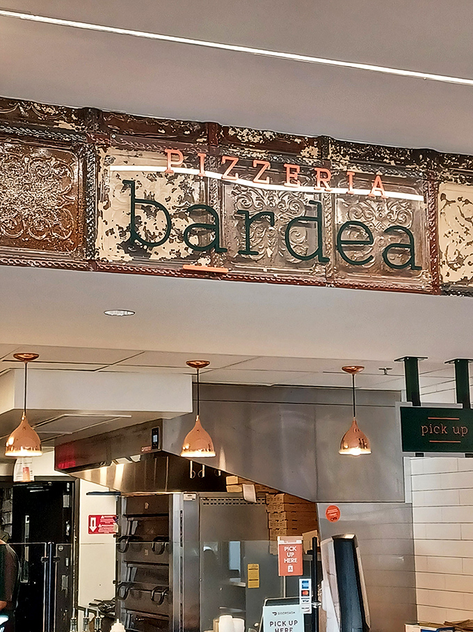 Bardea's vintage-inspired sign brings artisanal flair to pizza. Those weathered metal tiles frame pizza promises worth keeping.