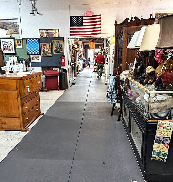 That red building against Cumberland's mountains looks like a barn that decided to become retail royalty.