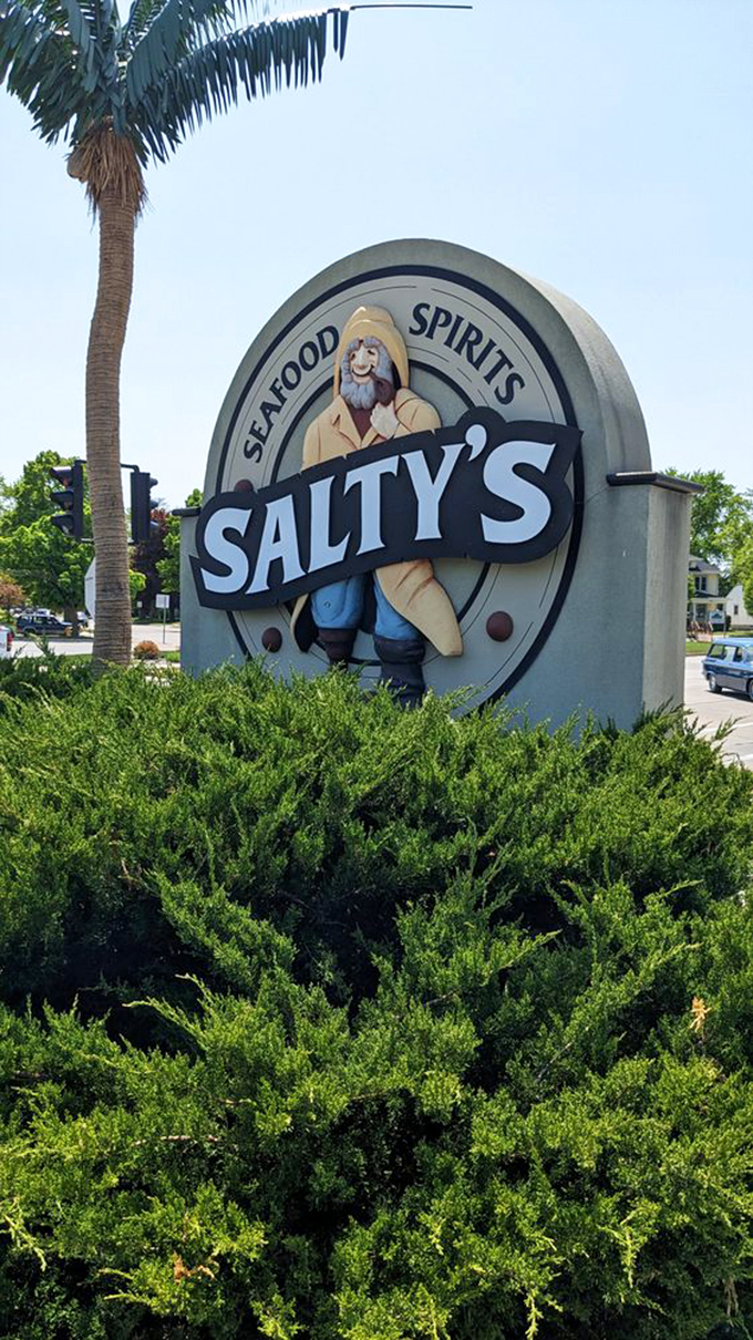 Salty's sign features a fisherman who looks like he's having way more fun than your last fishing trip that ended with zero catches.