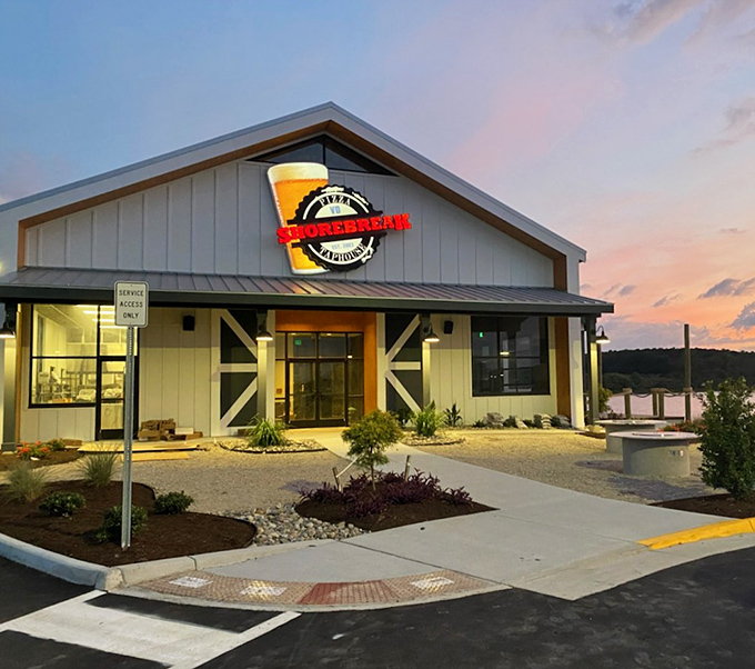 Barn-inspired architecture houses beach-worthy pizza. Shorebreak's rustic charm feels like the perfect coastal comfort food destination.