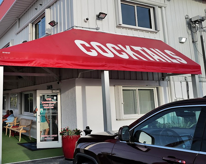 The red awning and simple exterior hide a Keys secret: grouper sandwiches worth driving miles for.