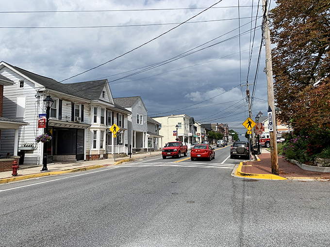Storm clouds gather dramatically over Taneytown's peaceful streets, adding free theatrical lighting to this budget-friendly small town.