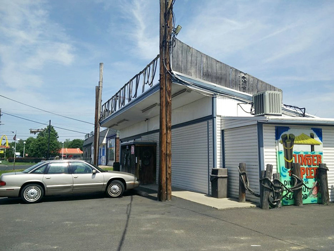 Weathered like a favorite fishing boat, this humble spot serves up ocean flavors with authentic charm.