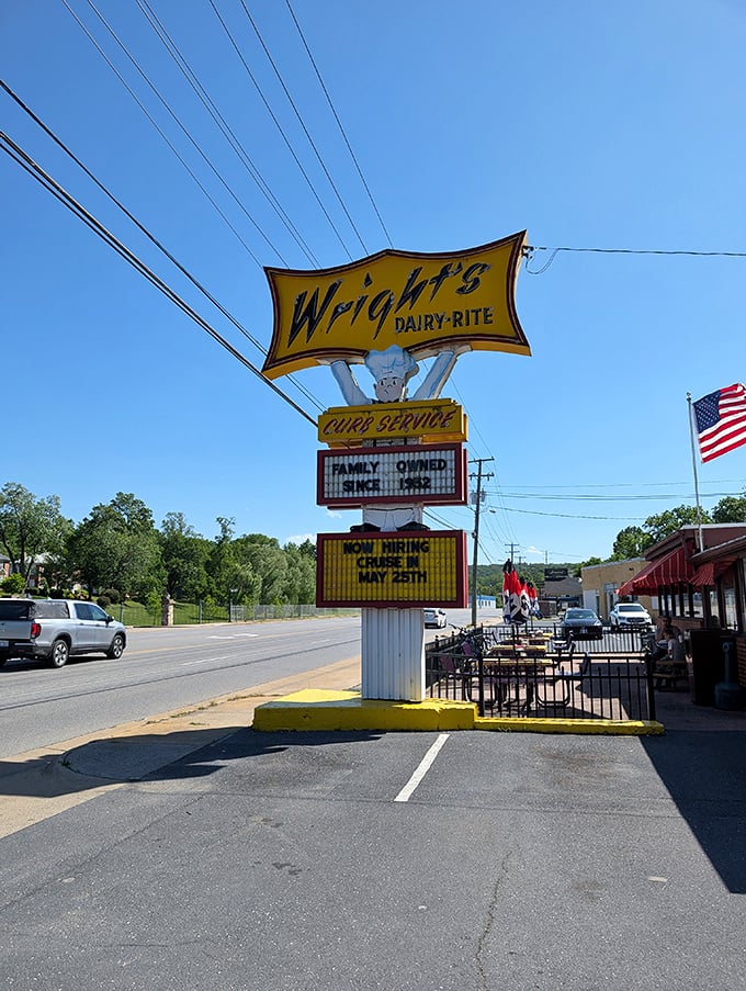 Wright's Dairy-Rite's vintage sign stands tall against the sky, a yellow beacon calling to burger lovers and nostalgia seekers alike.