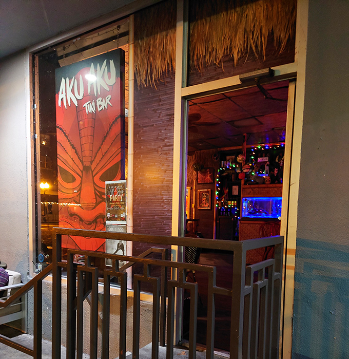 By night, Aku Aku's entrance glows with promise, beckoning city dwellers into a world where tropical flavors reign supreme.