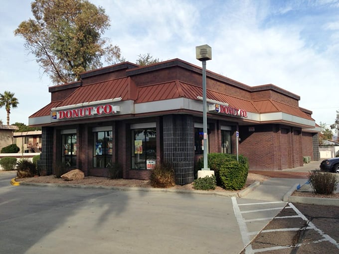 The desert sun casts perfect shadows on Arizona Donut Co.'s classic architecture. Some traditions are worth preserving, especially delicious ones.