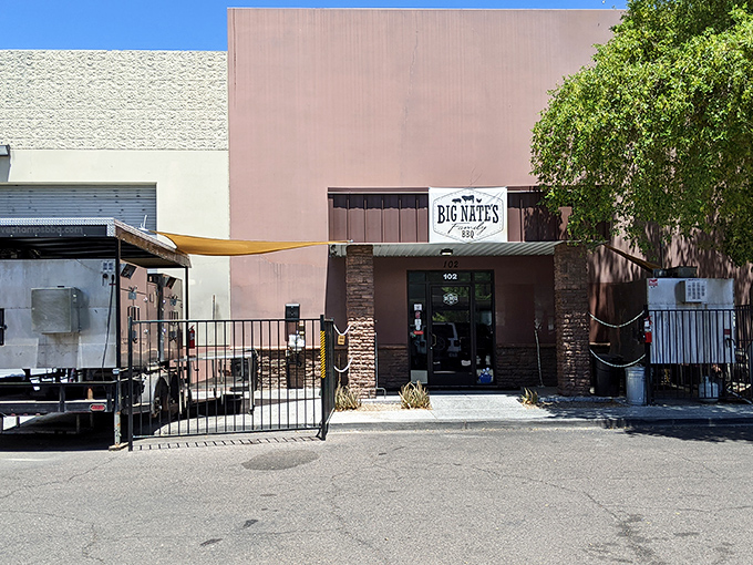 Desert landscaping frames the entrance to Big Nate's &ndash; where Arizona's natural beauty meets its delicious, smoky counterpart.
